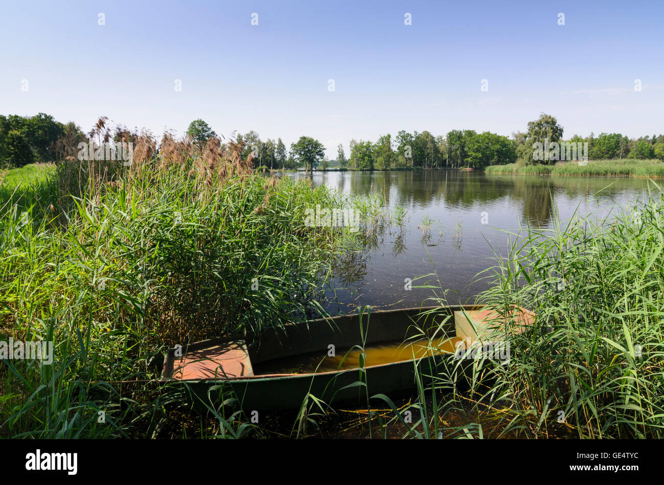 Fishpond of trebon pond landscape with fishing boat hi-res stock ...