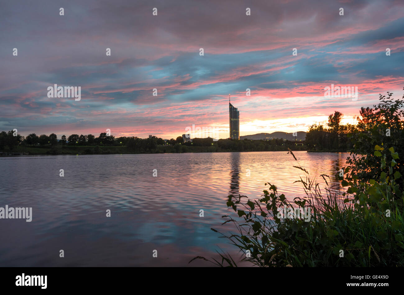 New danube and the millennium tower at sunset hi-res stock photography ...