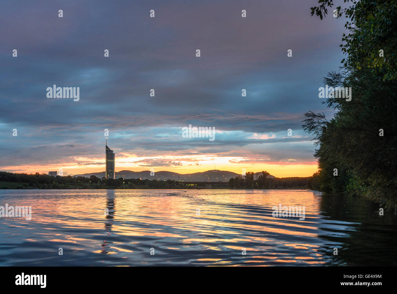 Wien, Vienna: New Danube and the Millennium Tower at sunset, Austria ...