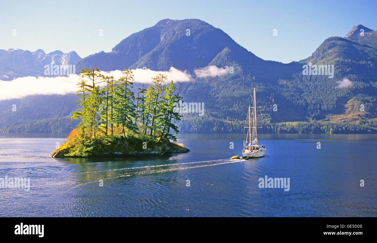 A sailboat navigates a narrow passage between islands in the Inside ...