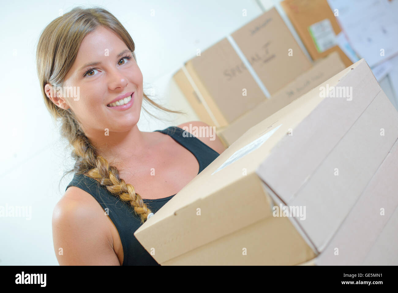 woman carrying boxes Stock Photo - Alamy
