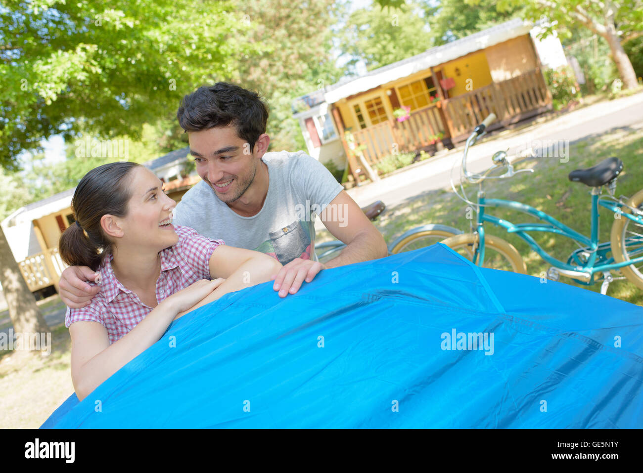 Couple on campsite Stock Photo - Alamy