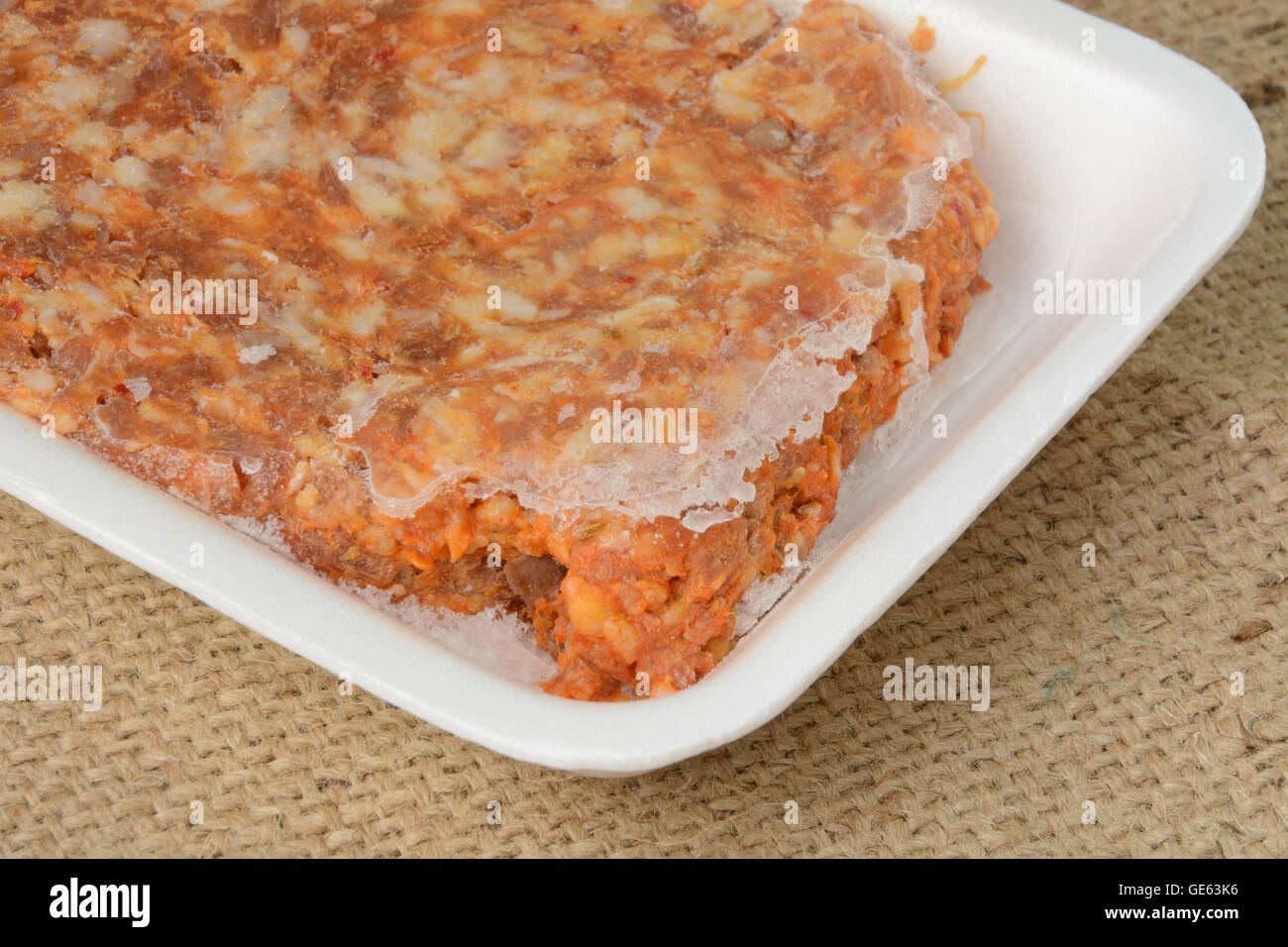 Frozen Italian sausage in styrofoam meat packaging thawing Stock Photo ...