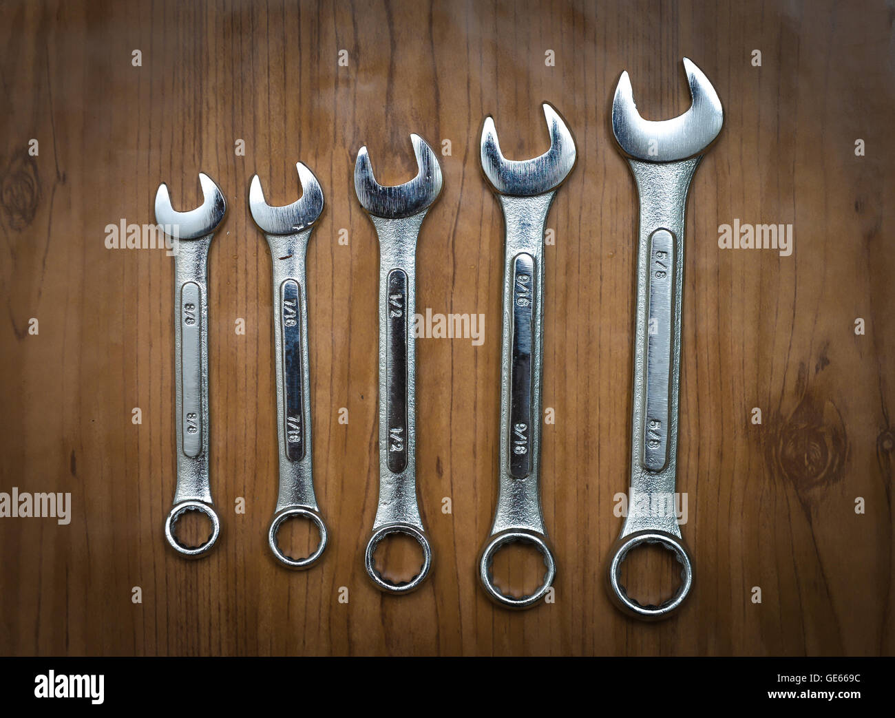 Set of wrenches on wood background Stock Photo - Alamy