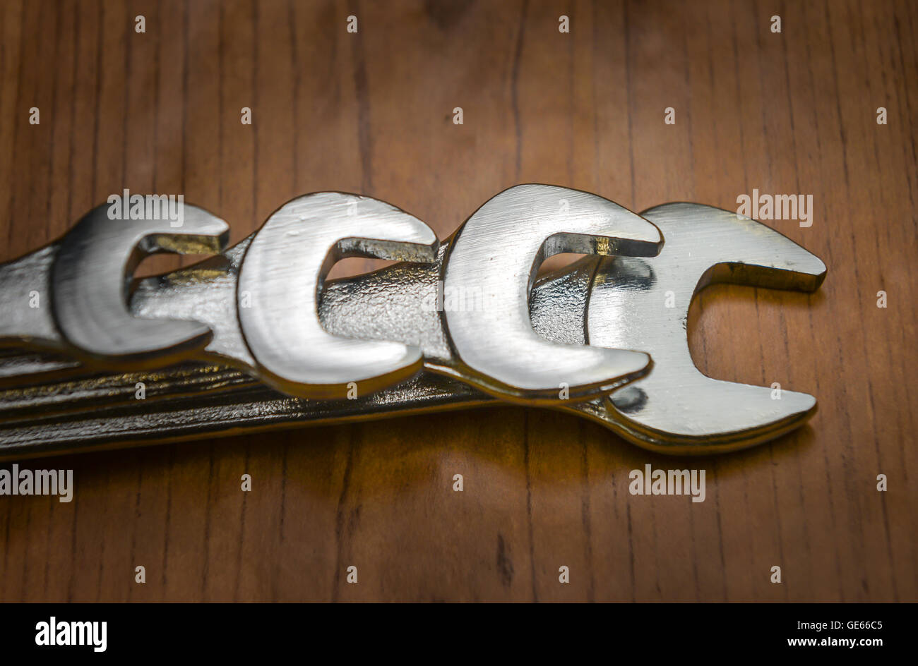 Set of wrenches on wood background Stock Photo - Alamy