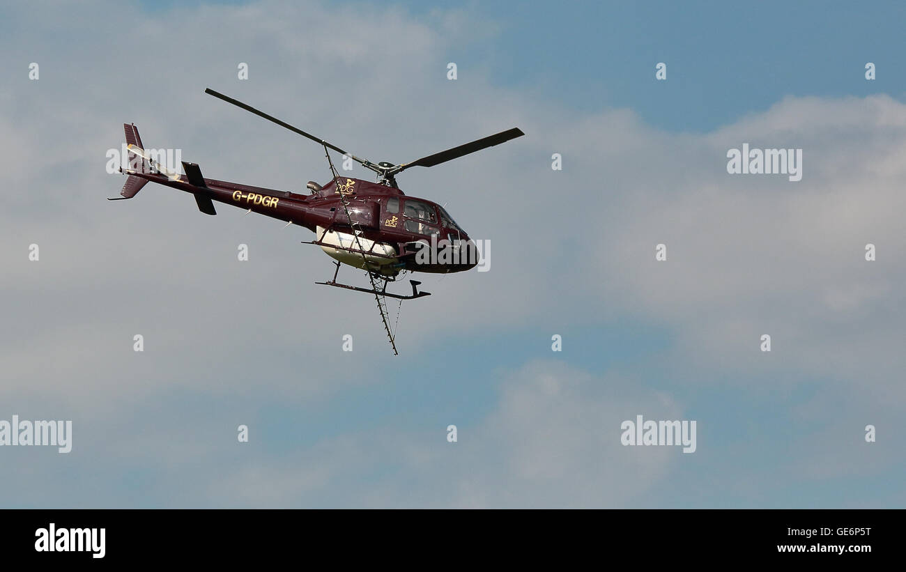 Helicopter in flight ready to spray pesticide and fertilizer Stock ...