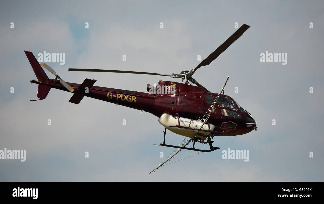 Helicopter in flight ready to spray pesticide and fertilizer Stock ...