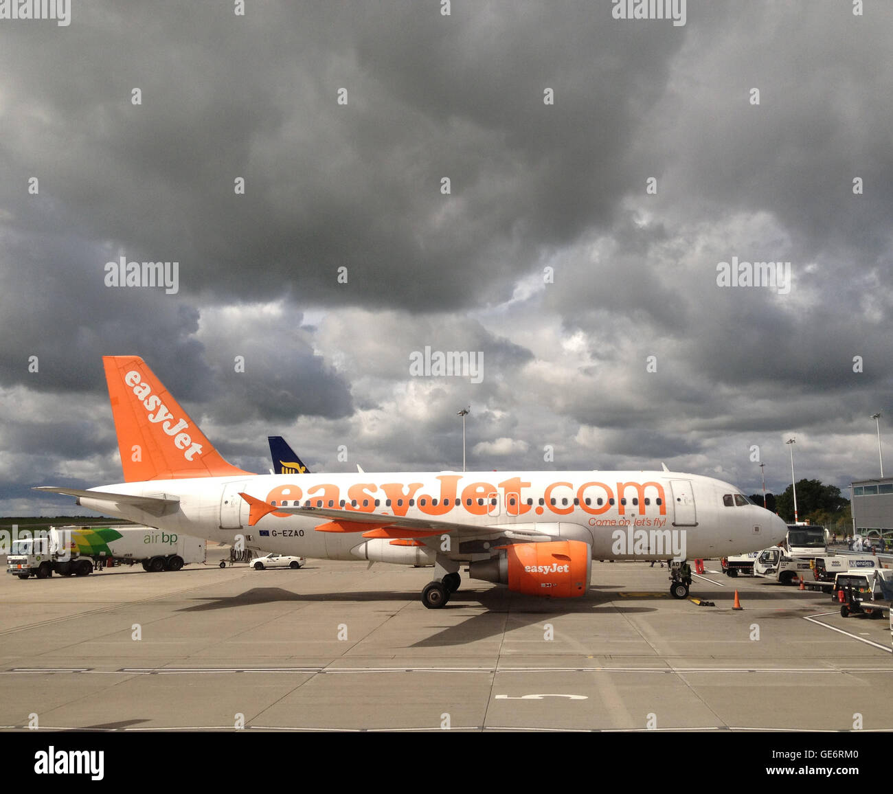 Easyjet aircraft parked at Bristol Airport, UK, with roiling clouds ...