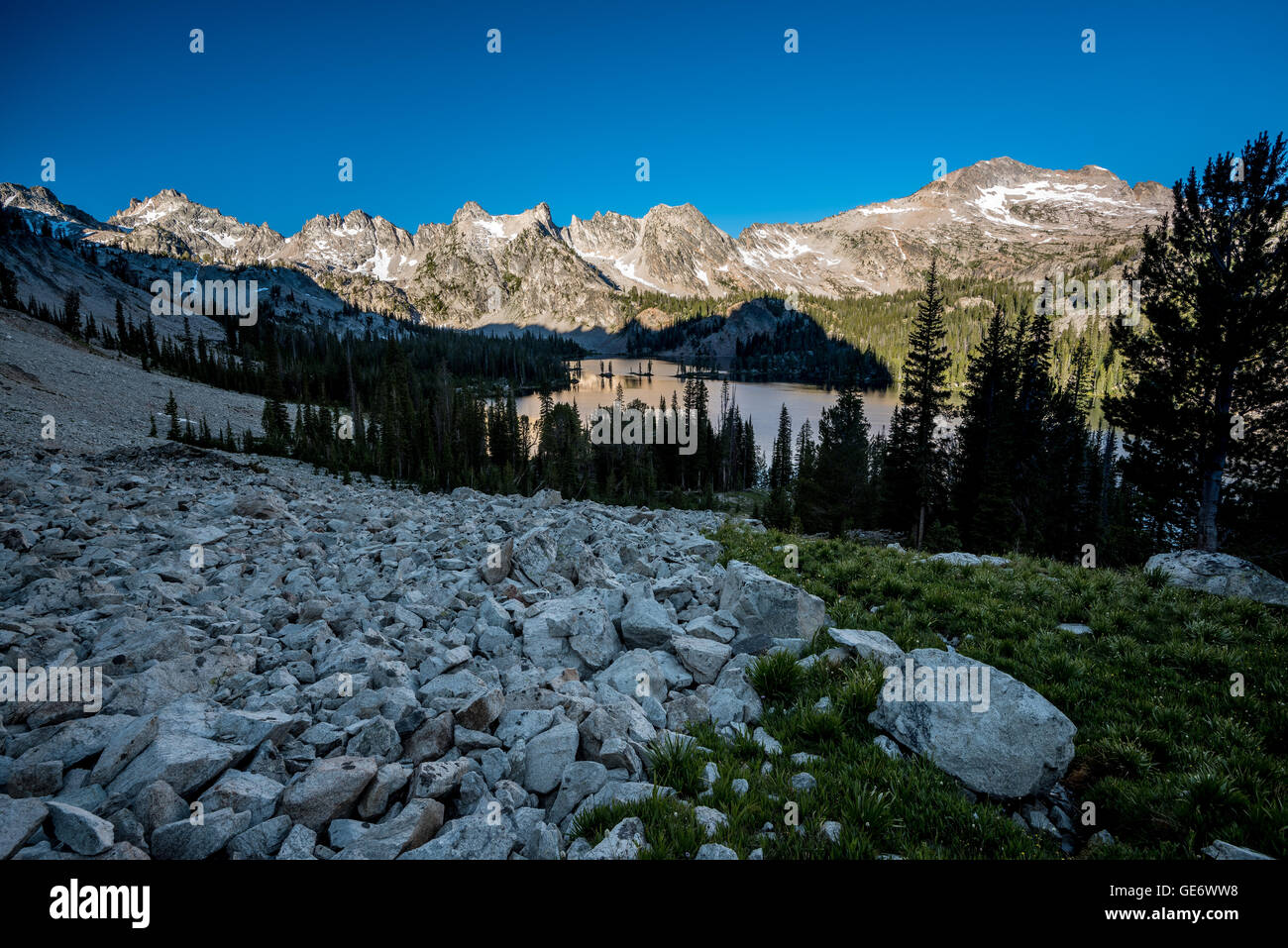 Natural nature mountain lake with talus rocks and forest Stock Photo ...