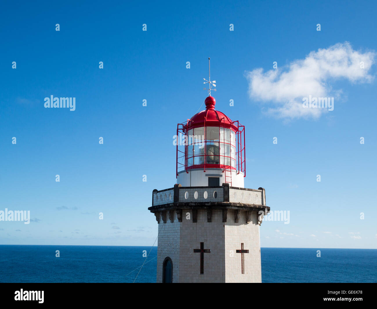 Lighthouse top with blue sky Stock Photo - Alamy