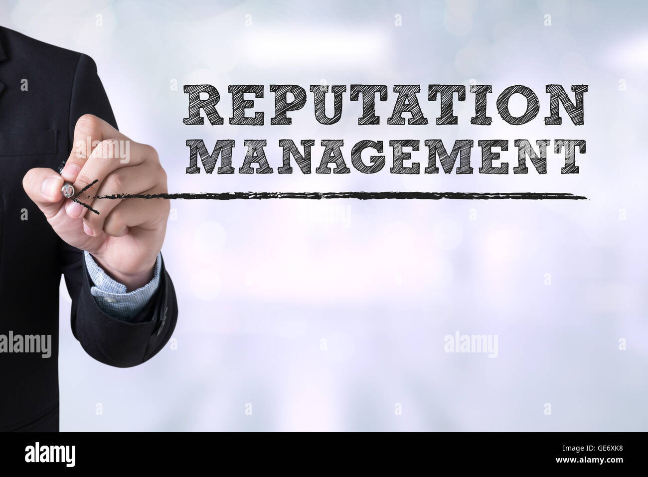 REPUTATION MANAGEMENT CONCEPT Businessman drawing Landing Page on ...