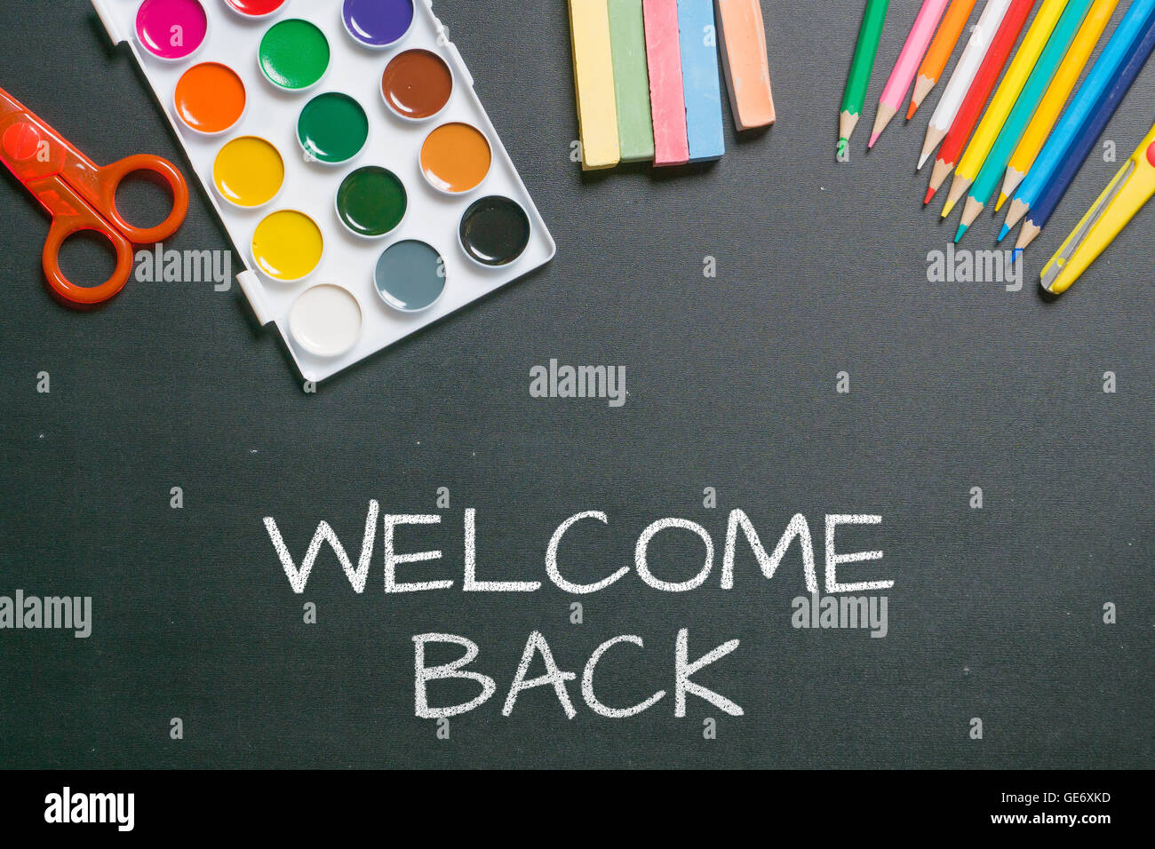 welcome back white chalk text on blackboard Stock Photo - Alamy