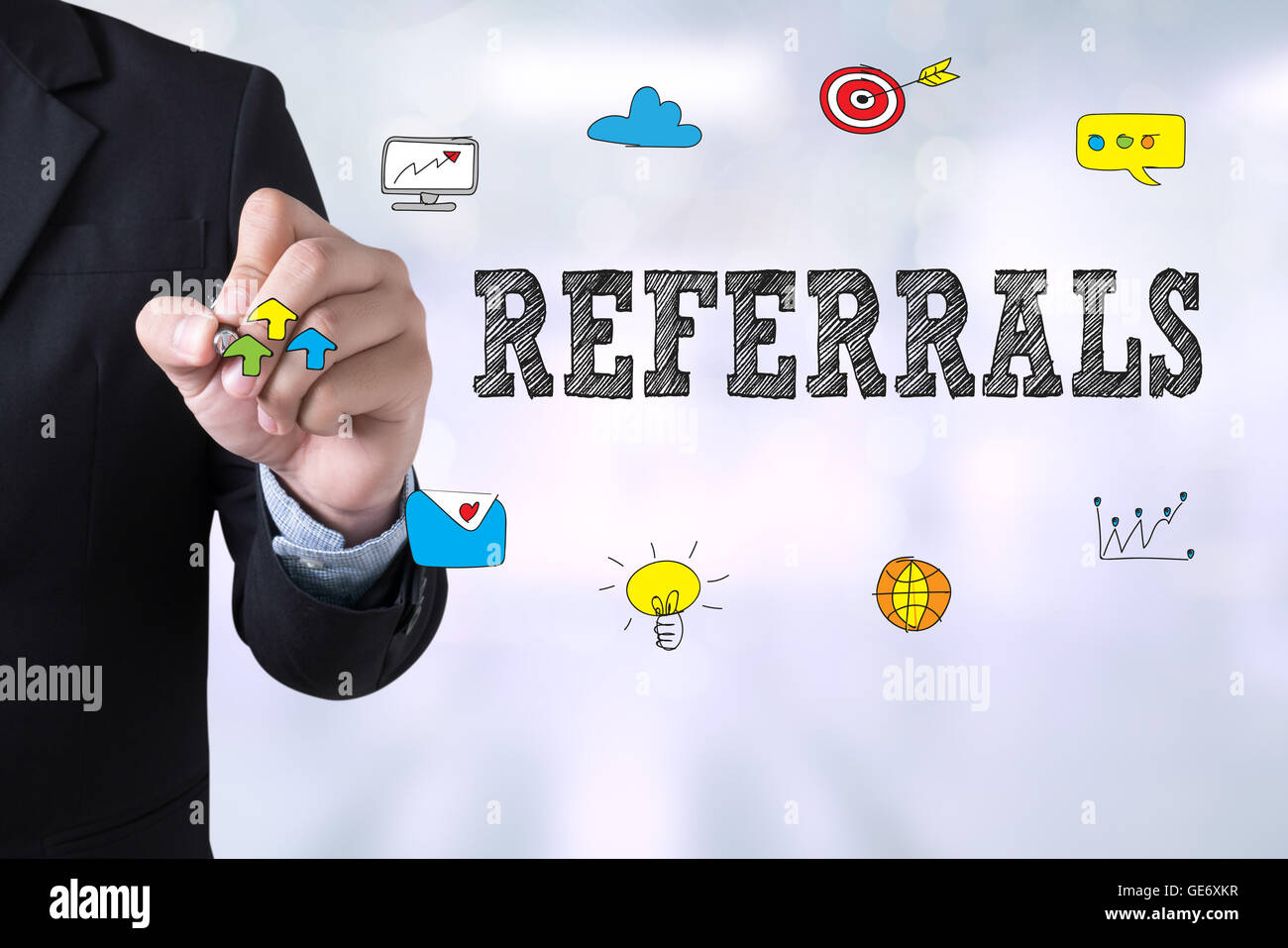 REFERRALS Businessman drawing Landing Page on blurred abstract ...