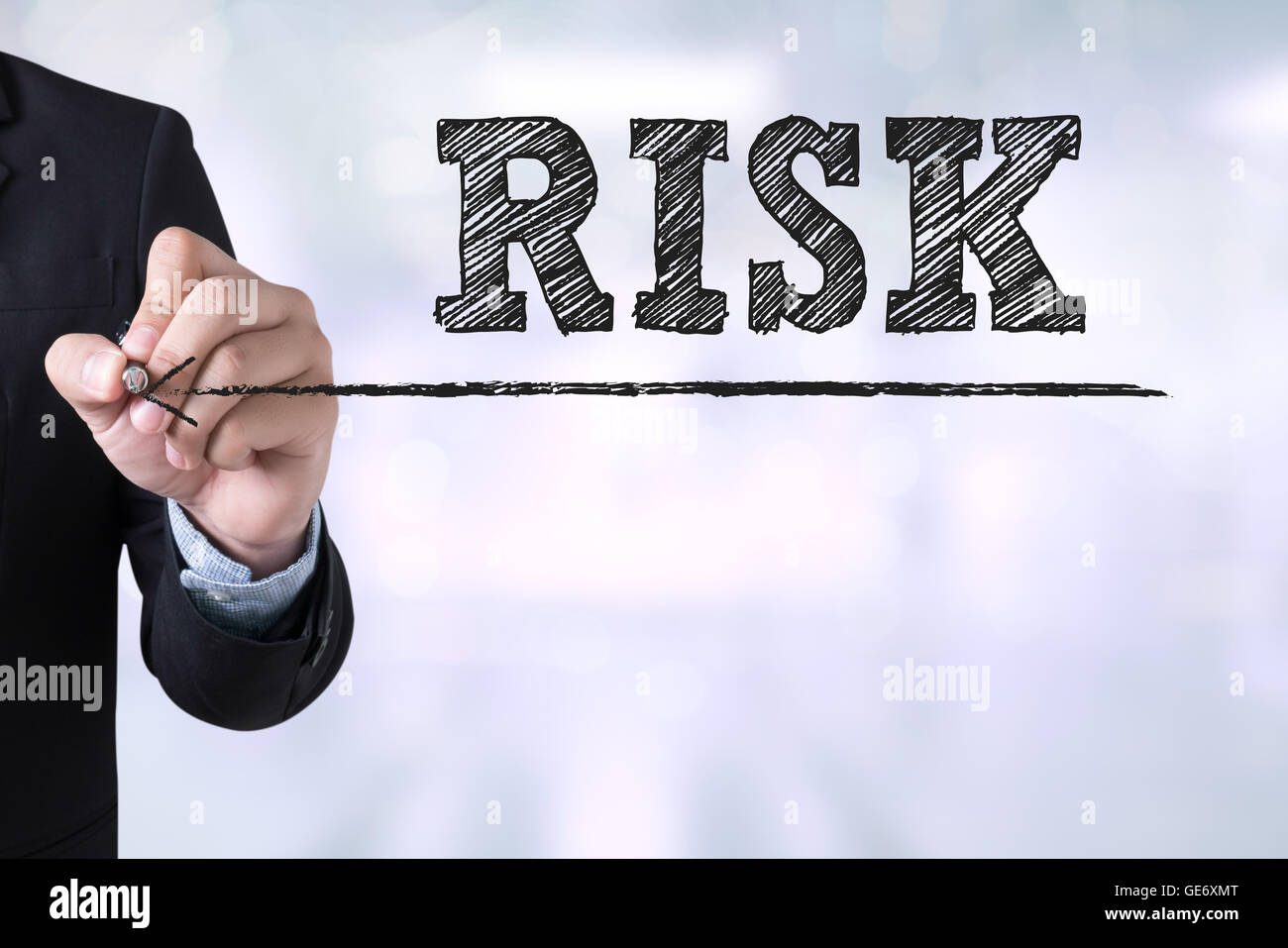 RISK Businessman drawing Landing Page on blurred abstract background ...