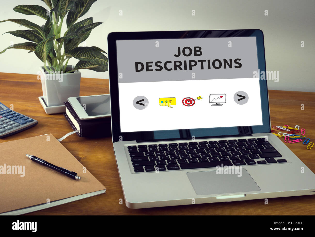 JOB DESCRIPTIONS Laptop on table. Warm tone Stock Photo - Alamy