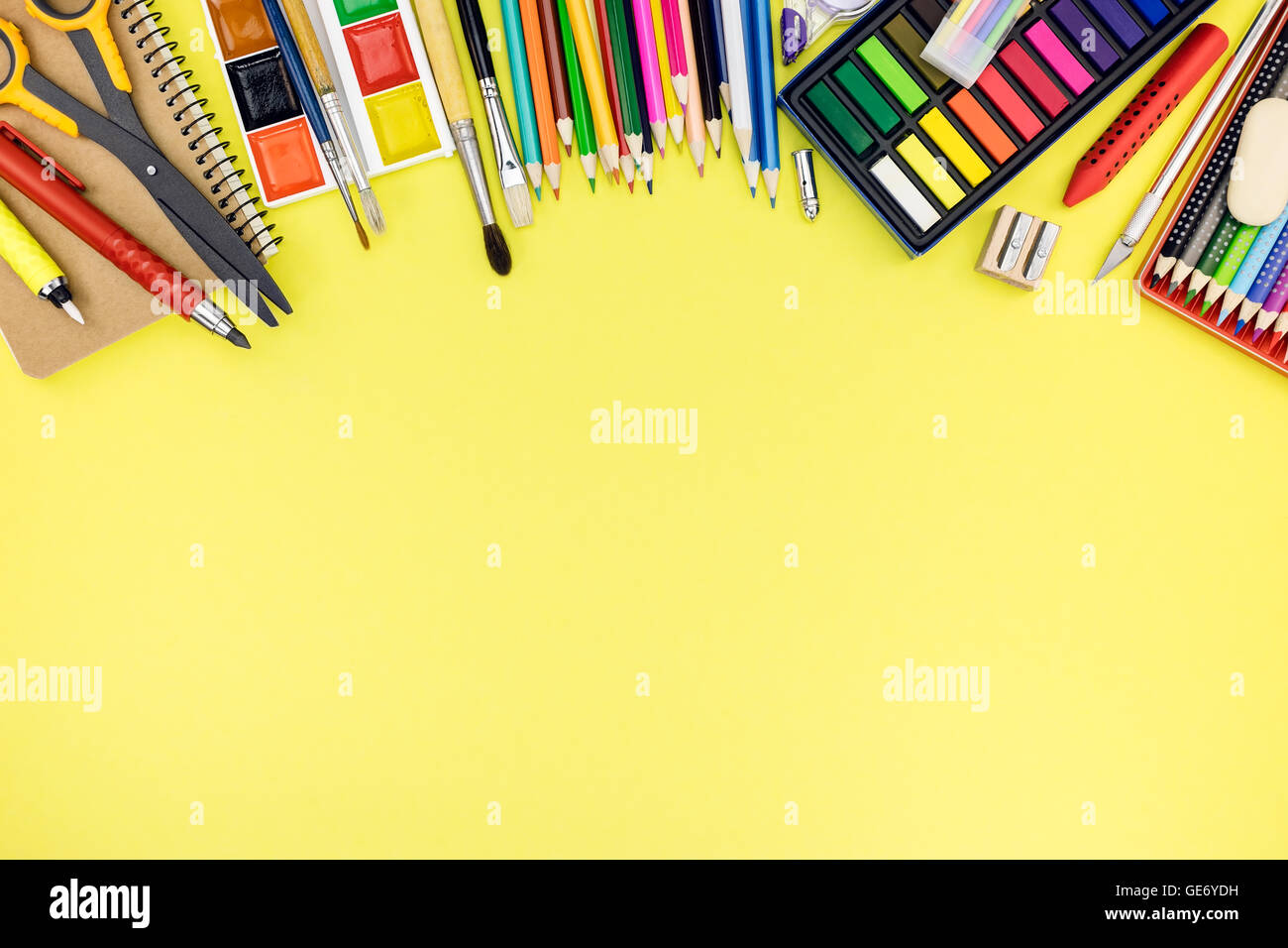 bright school supplies for education on yellow table background Stock ...