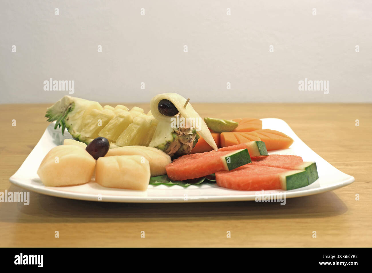 mixed fruit watermelon pineapple papaya cantaloupe and grape on white ...