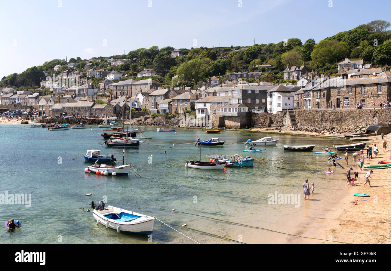 People on crowded beach in Mousehole village, Cornwall, England, UK ...