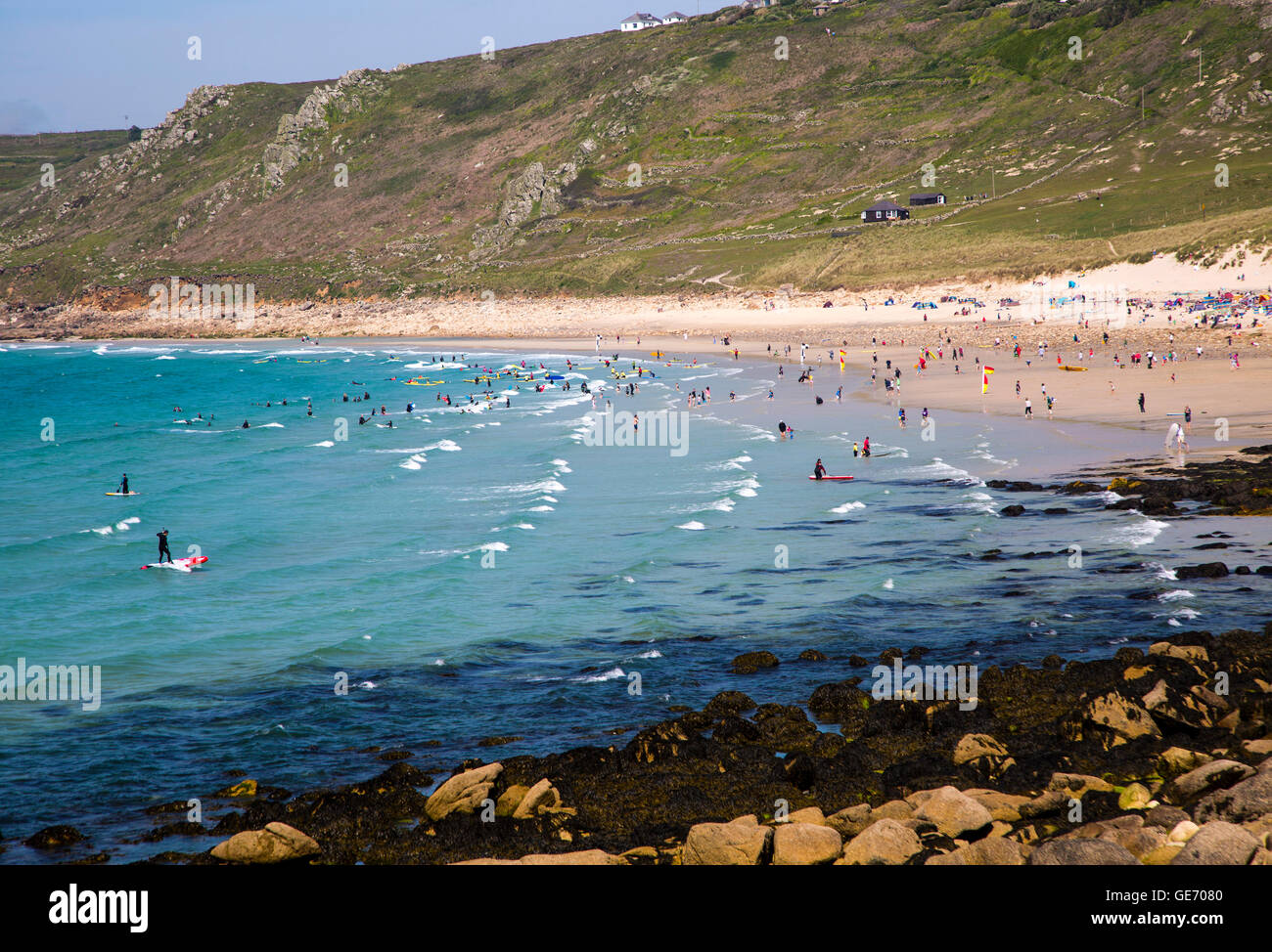 Coastal scenery with busy crowded sandy beach, Sennan Cove, Land's End ...