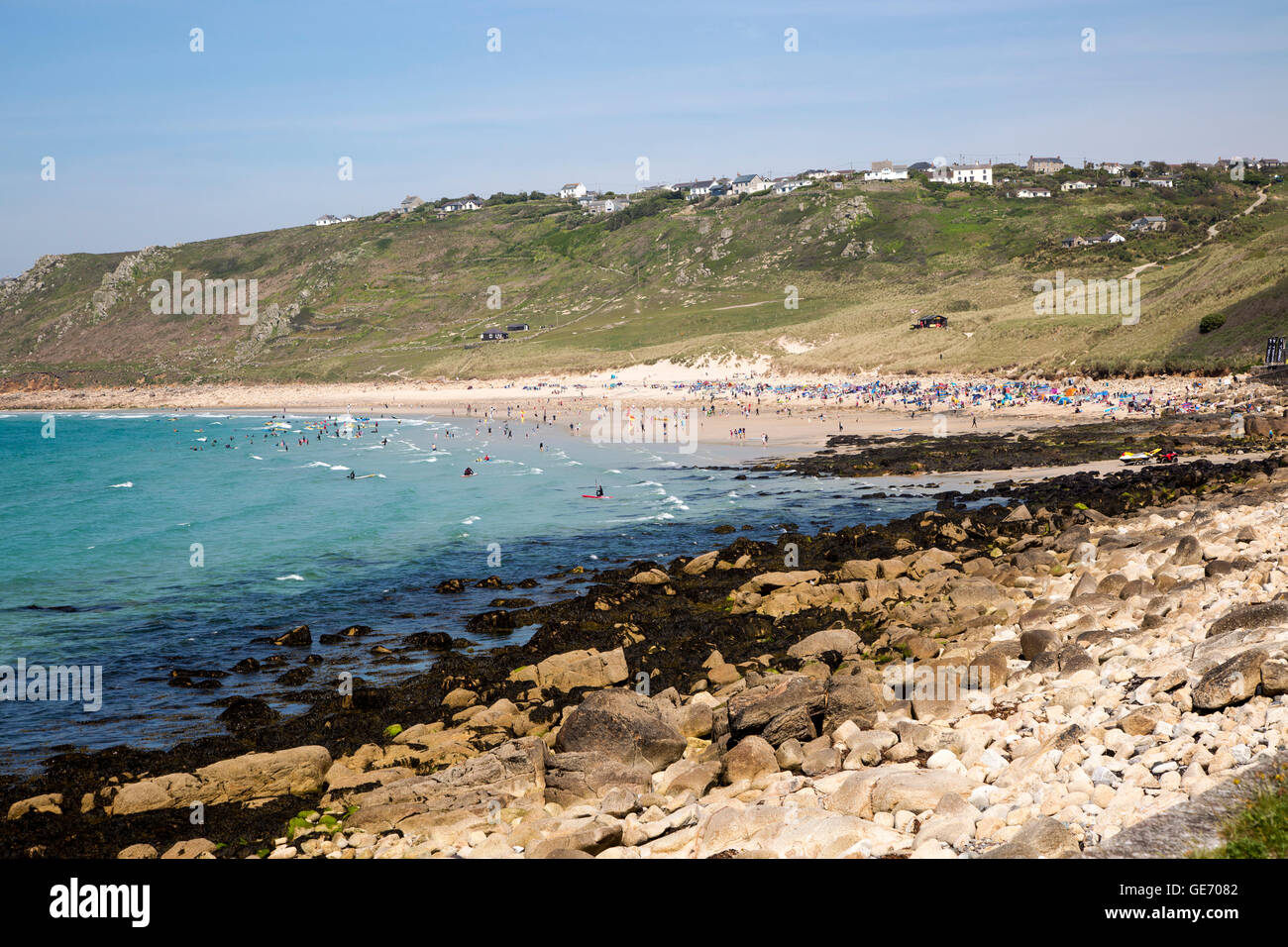 Coastal scenery with busy crowded sandy beach, Sennan Cove, Land's End ...
