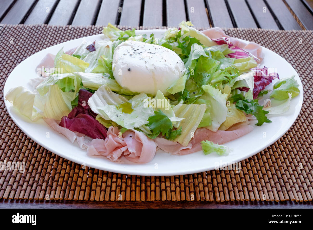 Fresh Italian salad with mozzarella and ham Stock Photo - Alamy