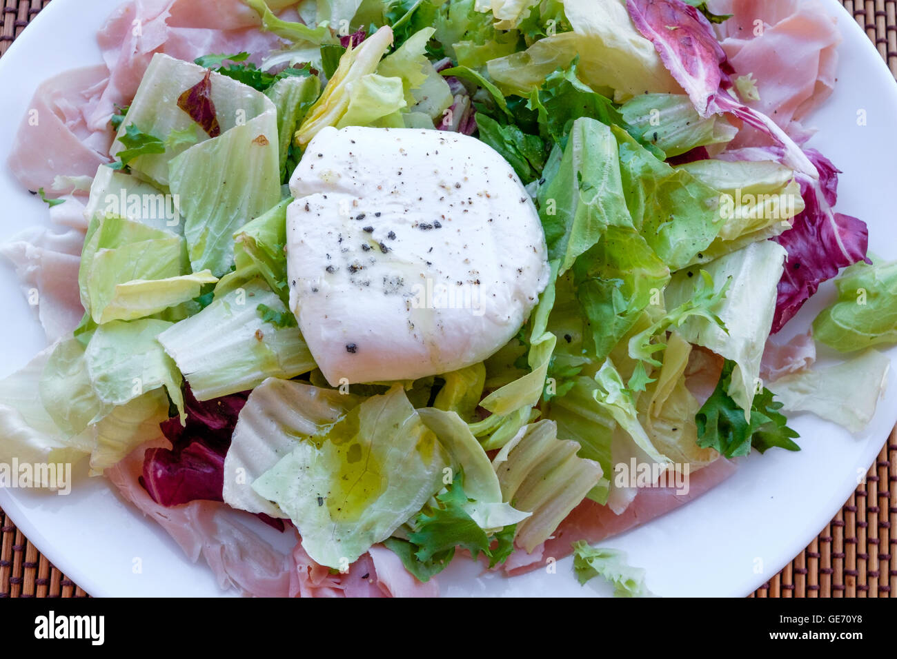 Fresh Italian salad with mozzarella and ham Stock Photo - Alamy