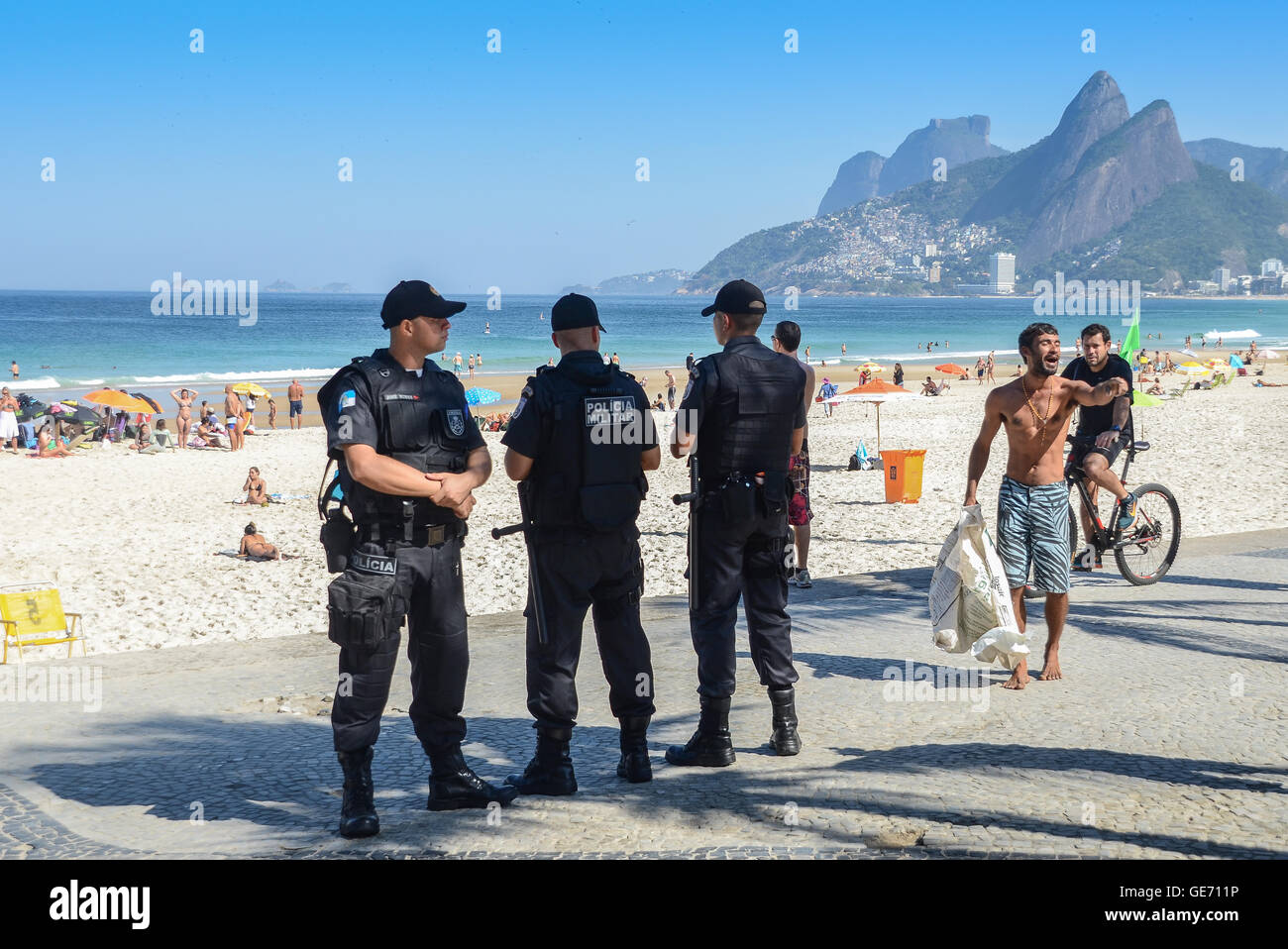 Rio de Janeiro police watch over tourists at Ipanema beach. Rio is ...