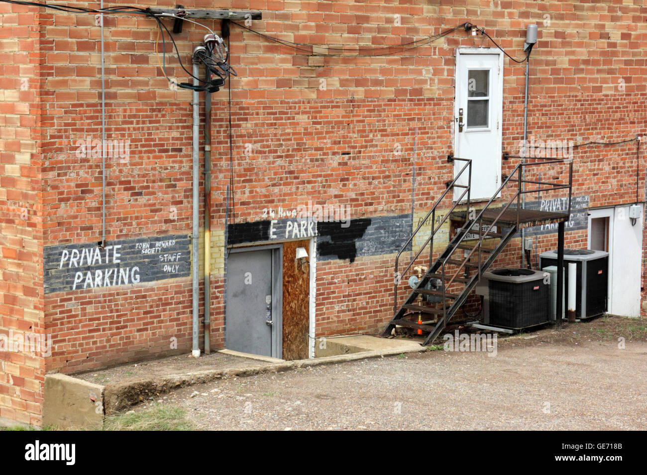 Private parking signs in an alley Stock Photo - Alamy