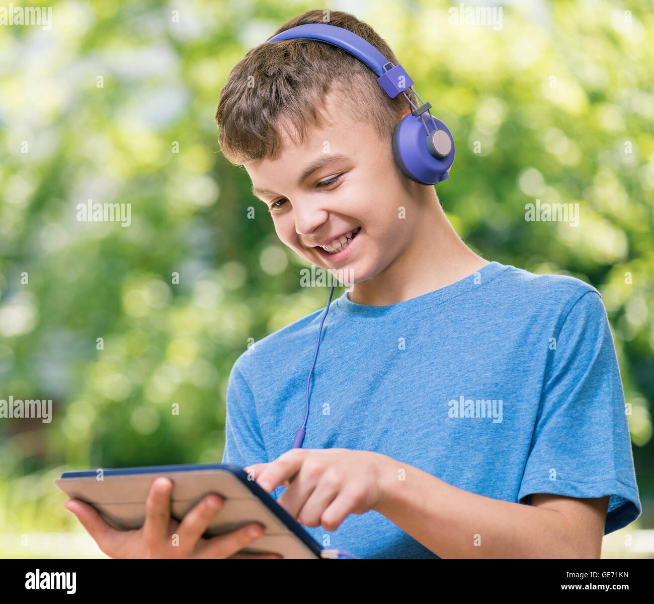 Boy with tablet Stock Photo - Alamy