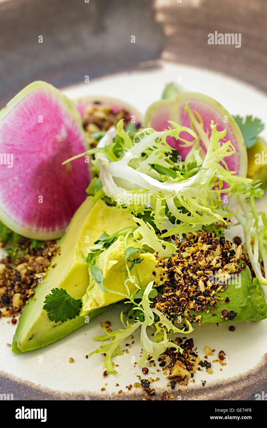 Chilled avocado with rainbow radish, frisee greens, scallions and ...