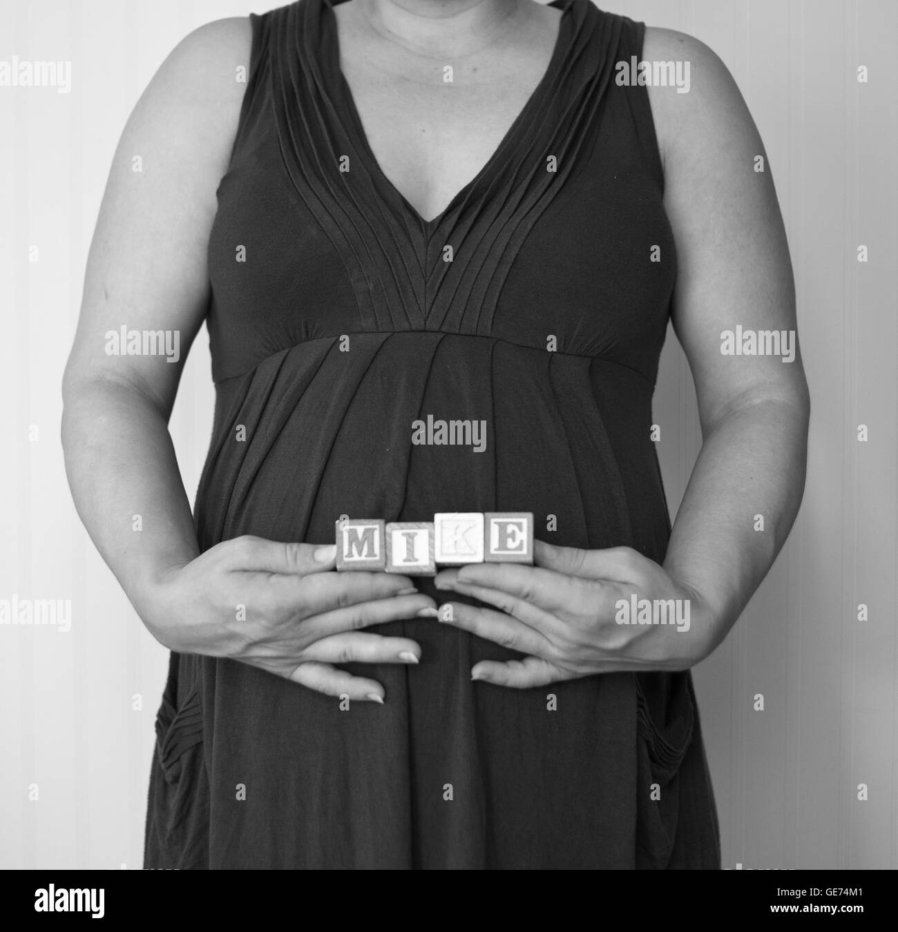 Pregnant woman holding baby blocks Stock Photo - Alamy