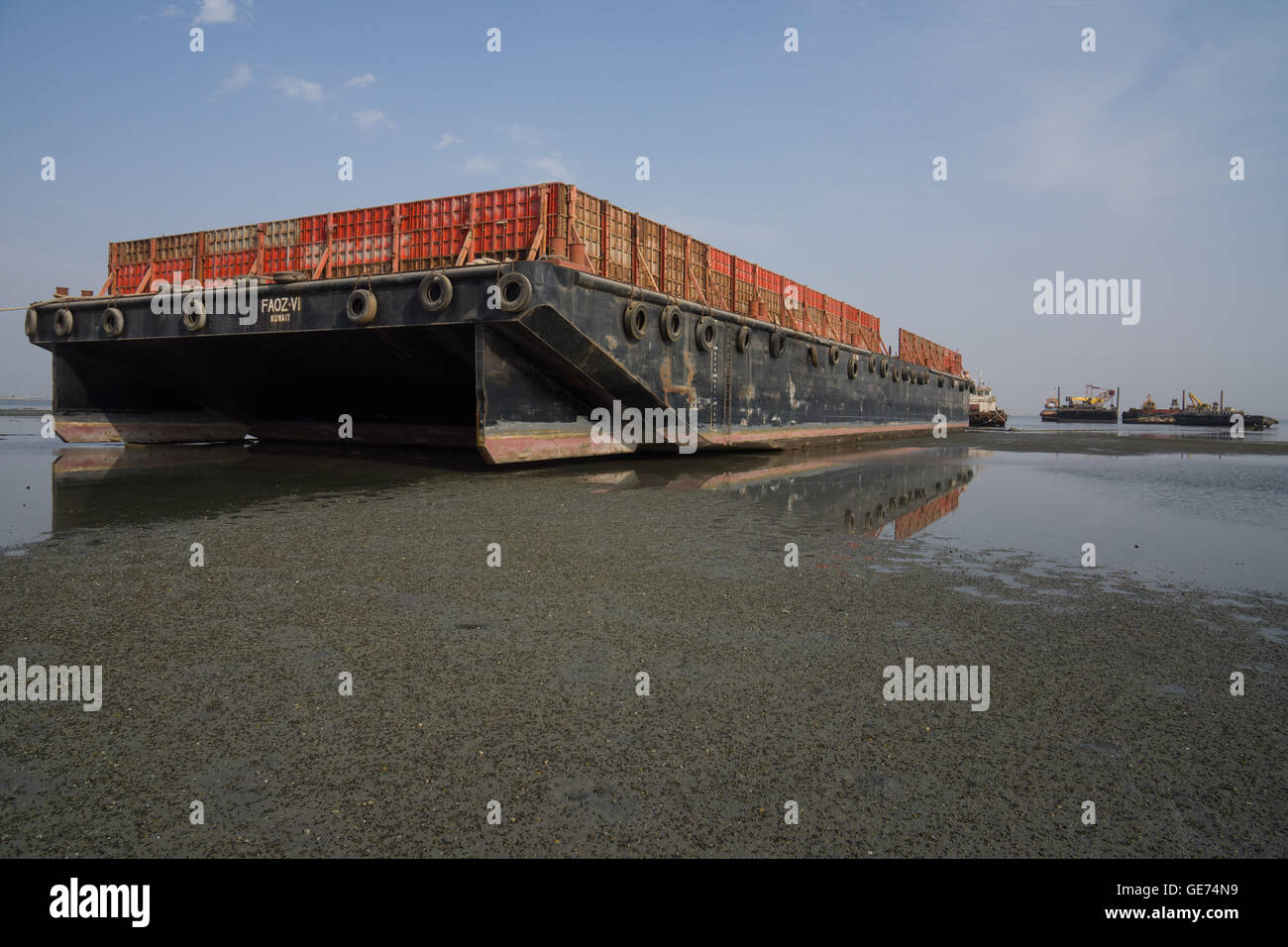 Large ocean barge for moving aggregate beached Stock Photo - Alamy