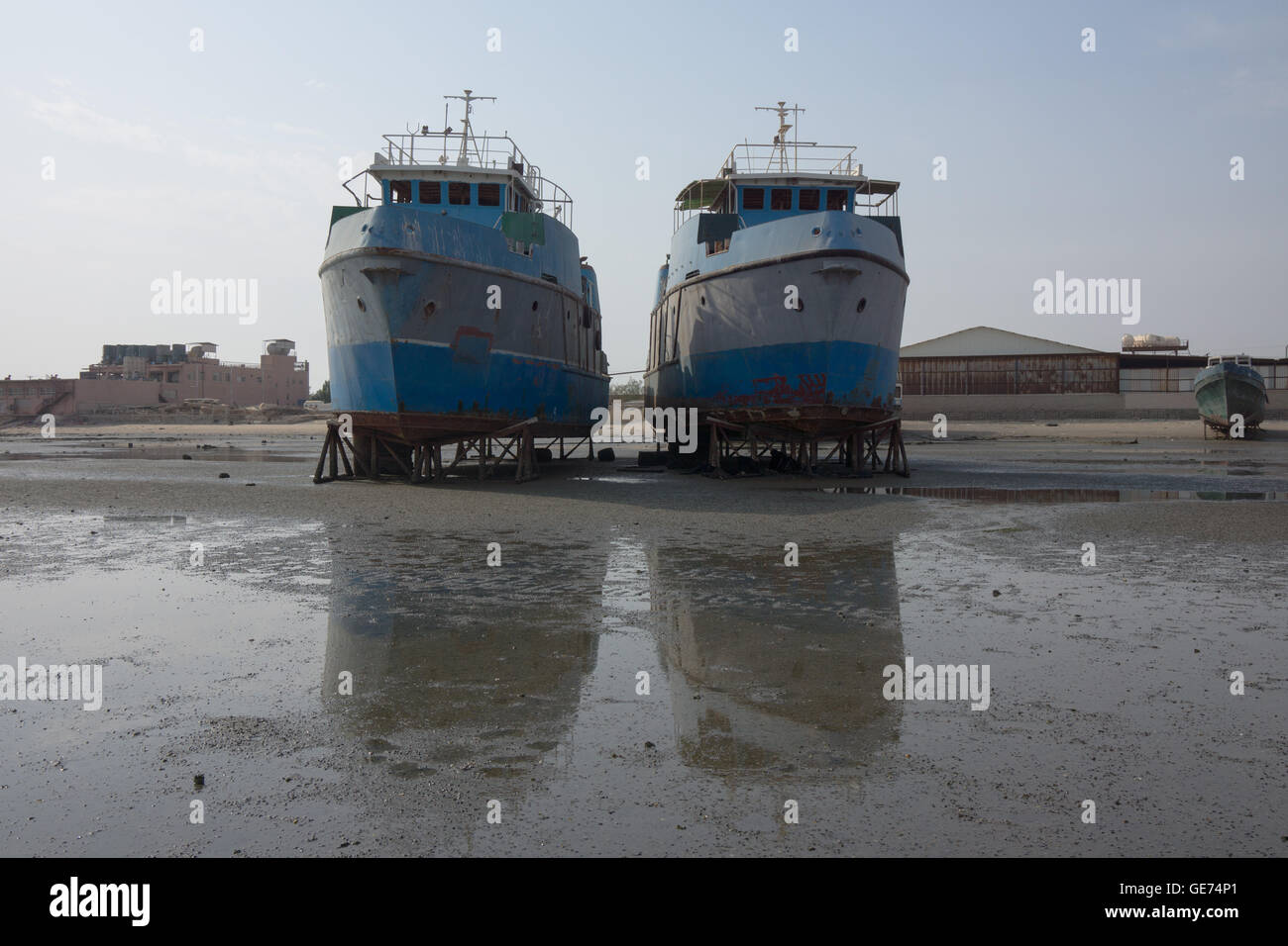 Two boats in dry dock on stands Stock Photo - Alamy