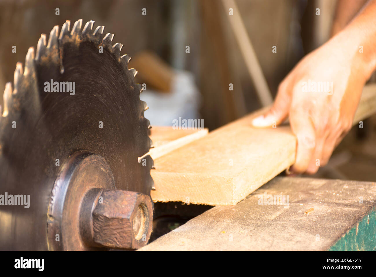 Man carpenter using table saw in workplace Stock Photo - Alamy