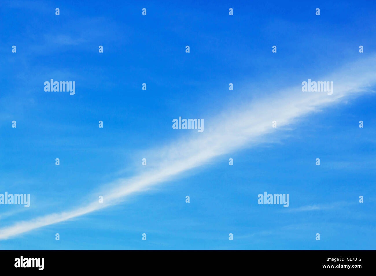 White clouds with a stretch of line on the blue sky Stock Photo - Alamy