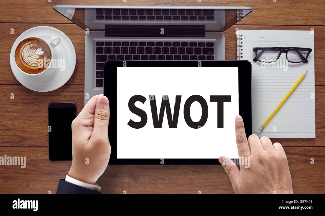 SWOT, on the tablet pc screen held by businessman hands - online, top ...