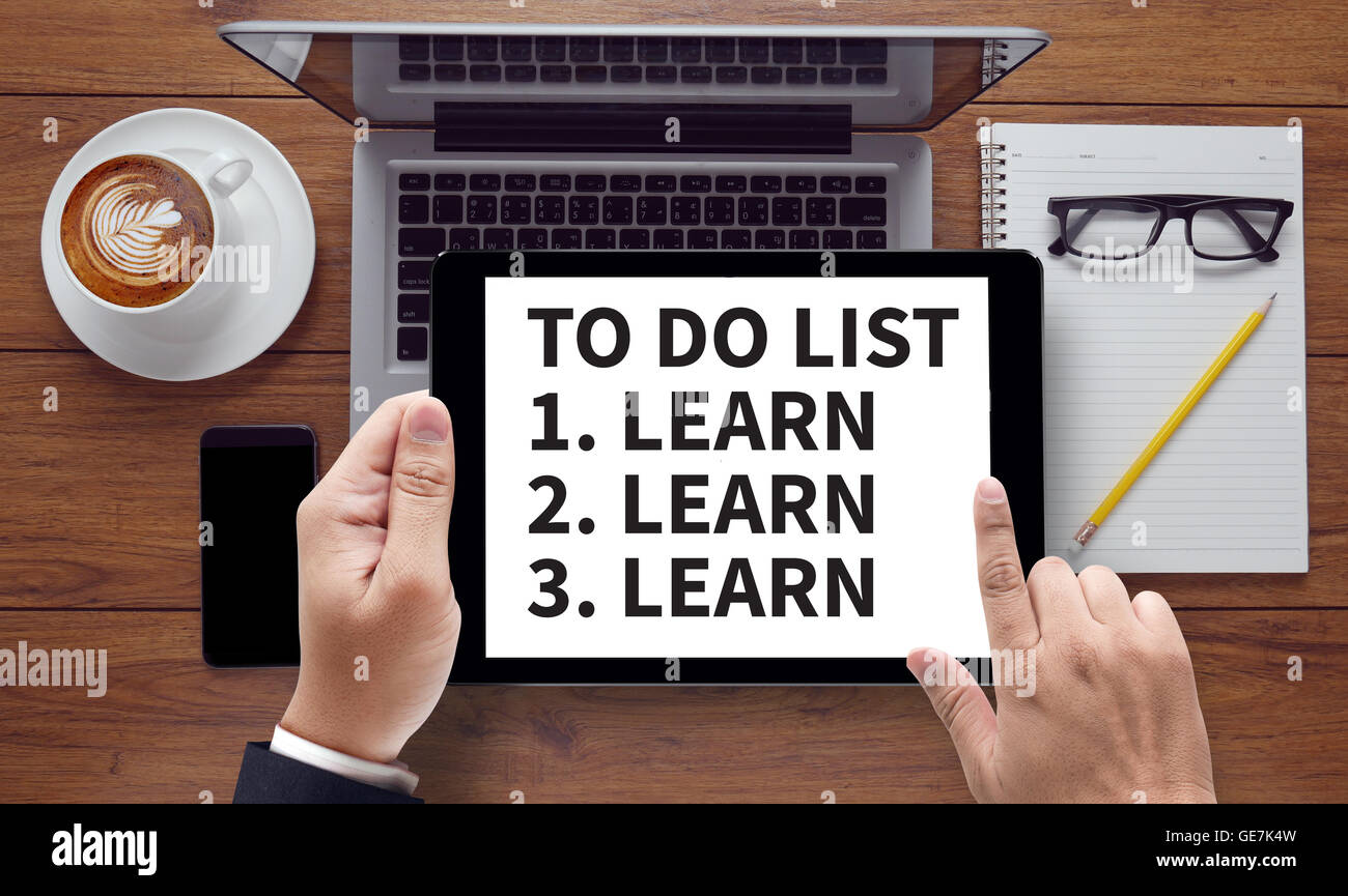 To Do List - LEARN , on the tablet pc screen held by businessman hands ...