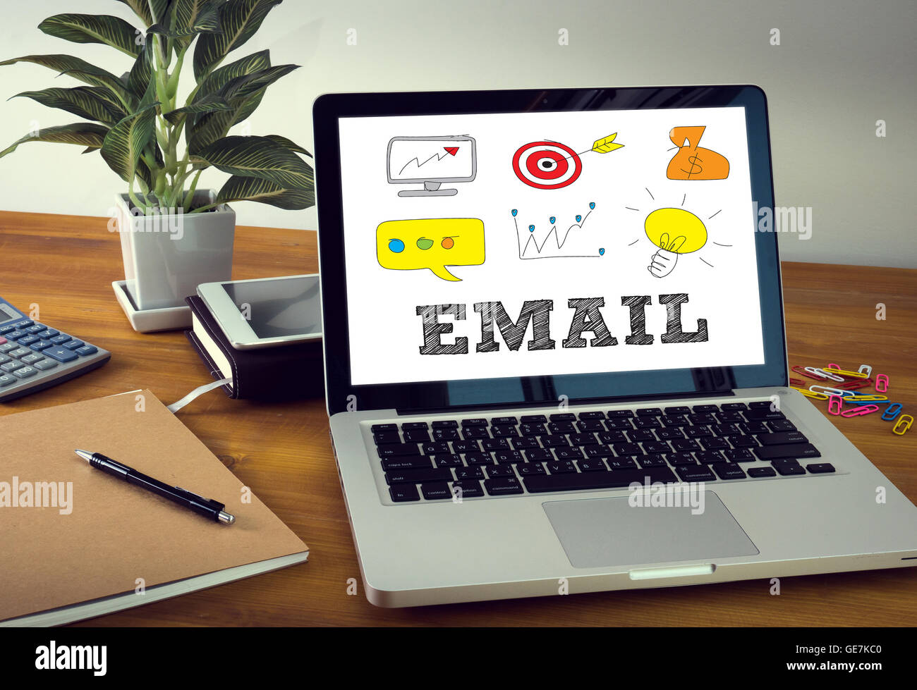 EMAIL Laptop on table. Warm tone Stock Photo - Alamy
