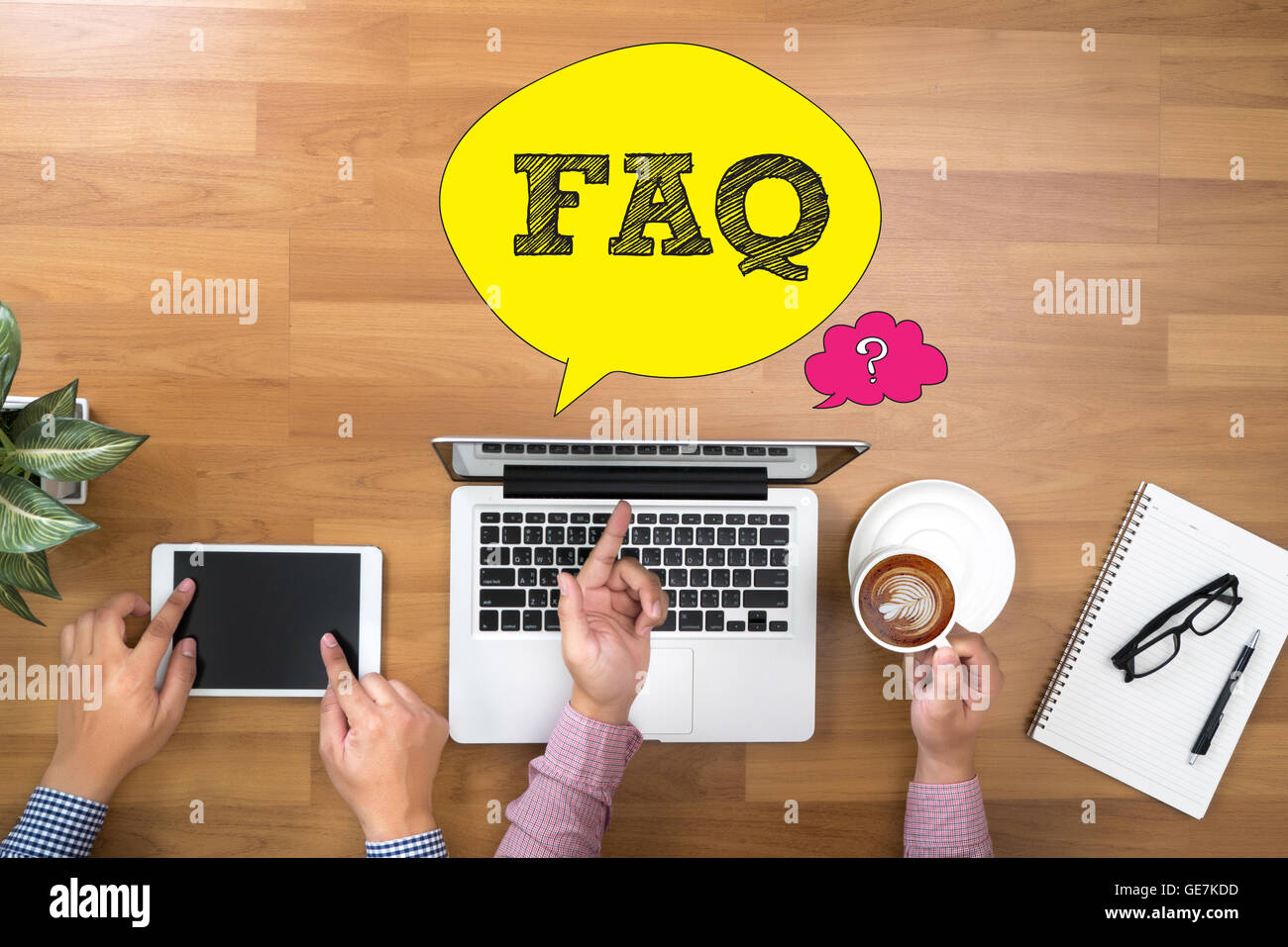 FAQ CONCEPT Two Businessman working at office desk and using a digital ...