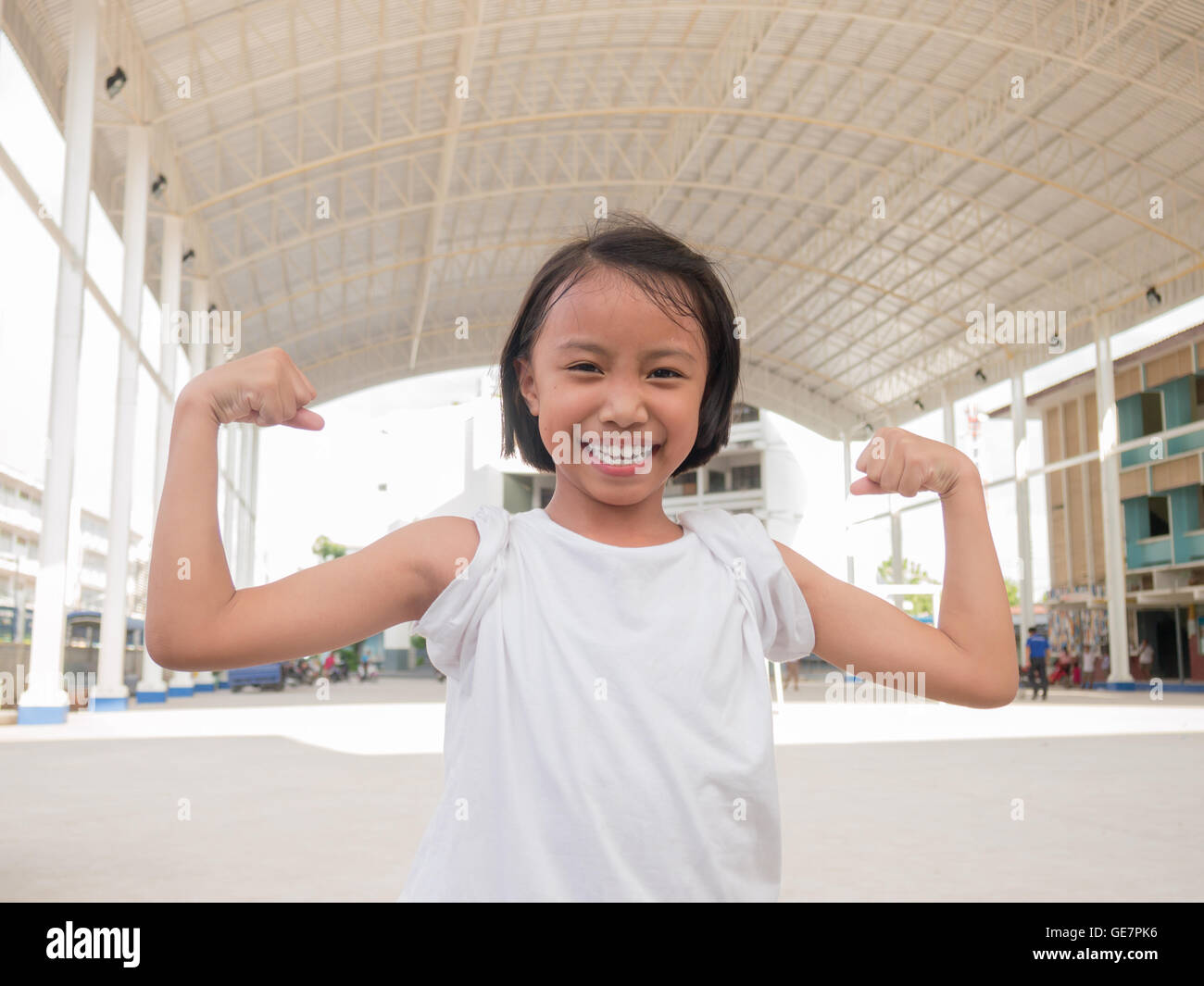 Happy Beautiful asian kids with drawn muscles. Girl power and feminism ...