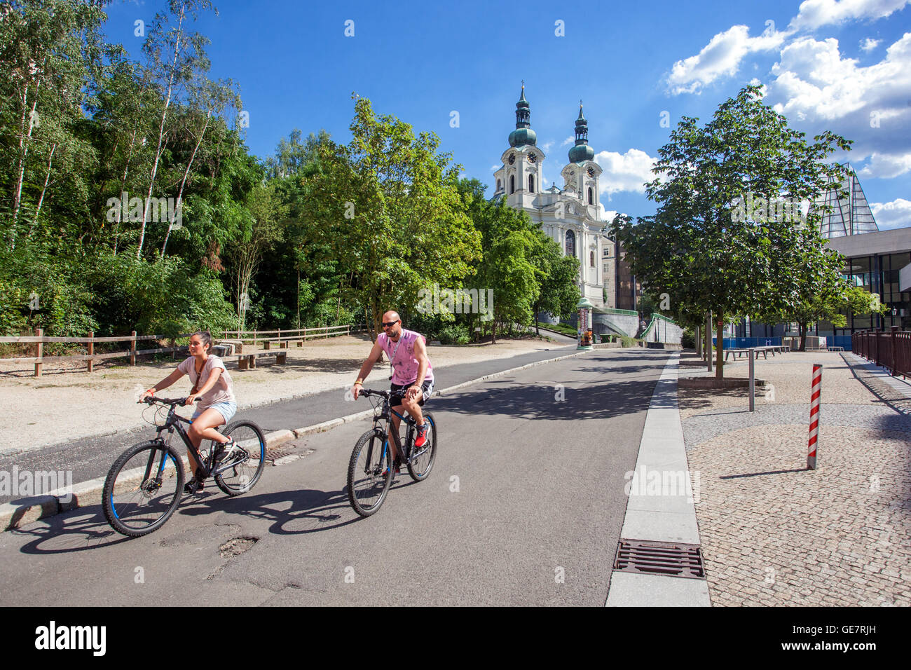 People ride a bike, Tourists on bicycles, Karlovy Vary, Czech Republic ...