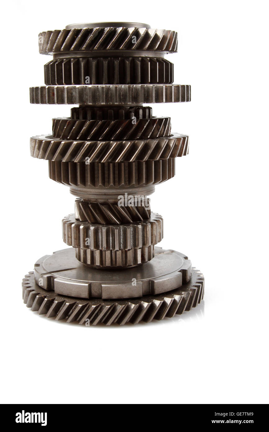 Steel cogs together on plain background Stock Photo - Alamy