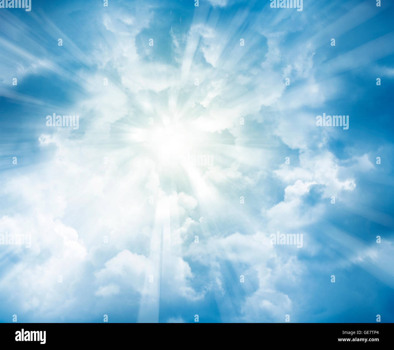Bright sun shining in clouds Stock Photo - Alamy