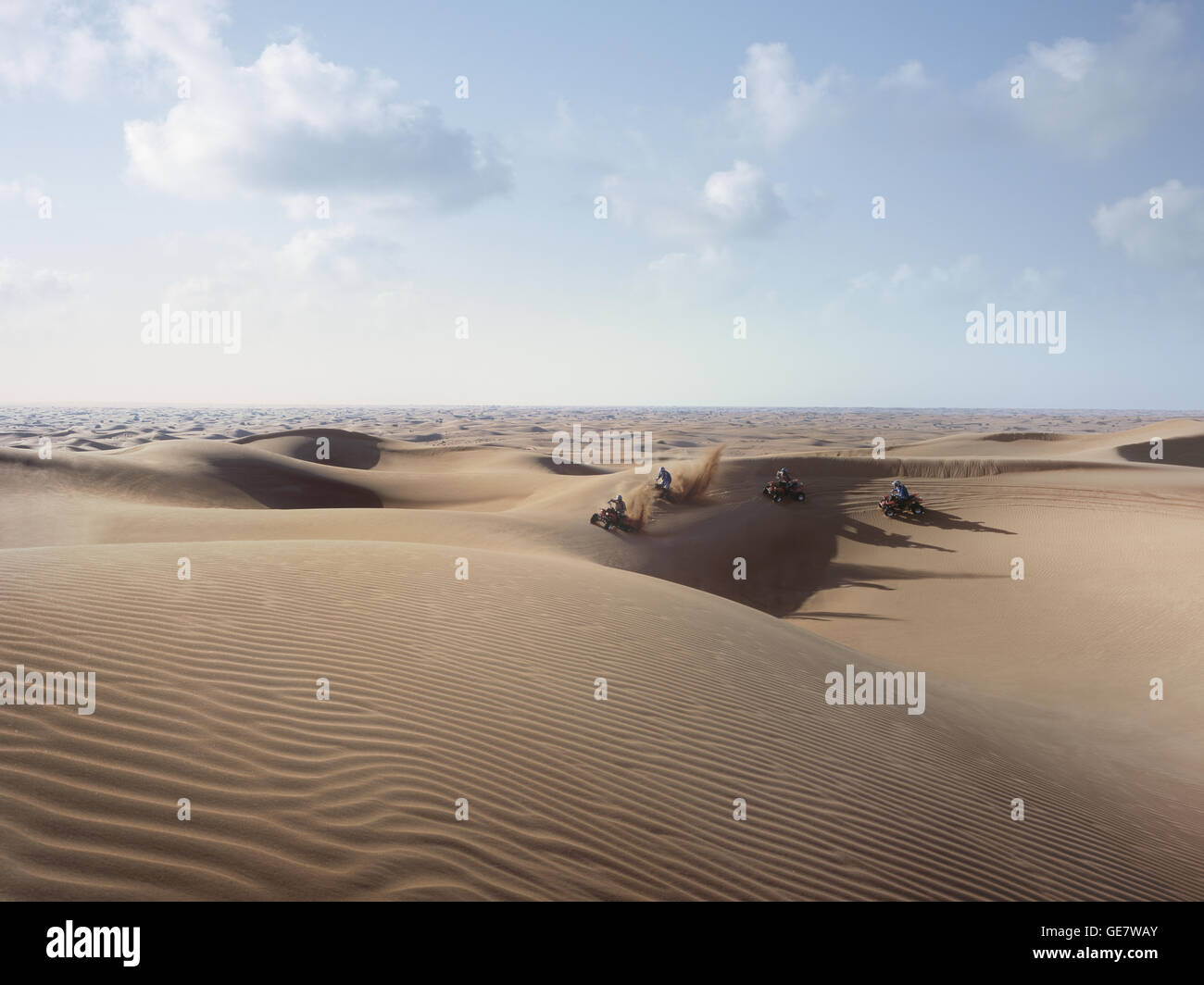Quad biking in the desert Stock Photo - Alamy