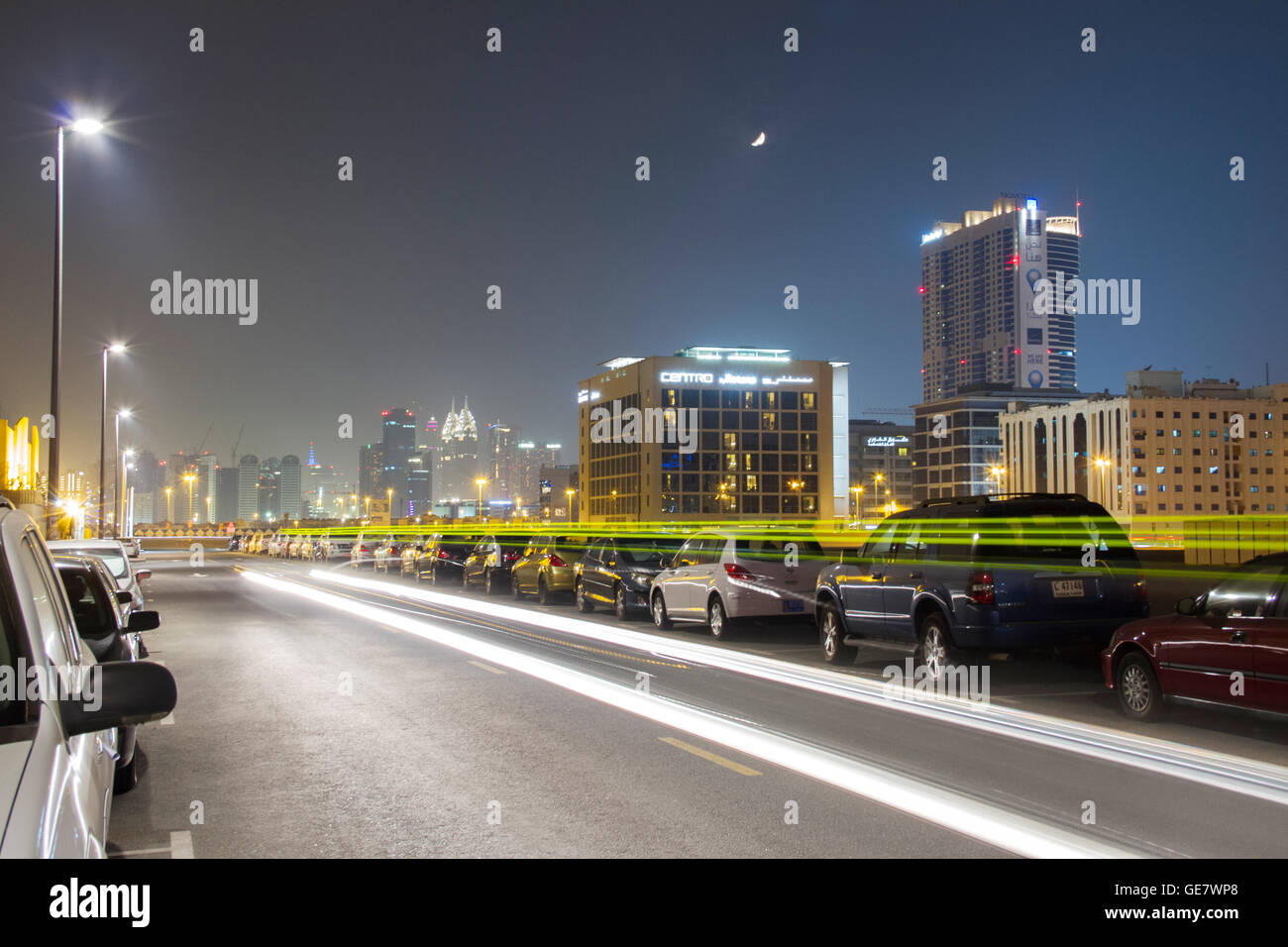 Dubai street at night and car parking Stock Photo - Alamy