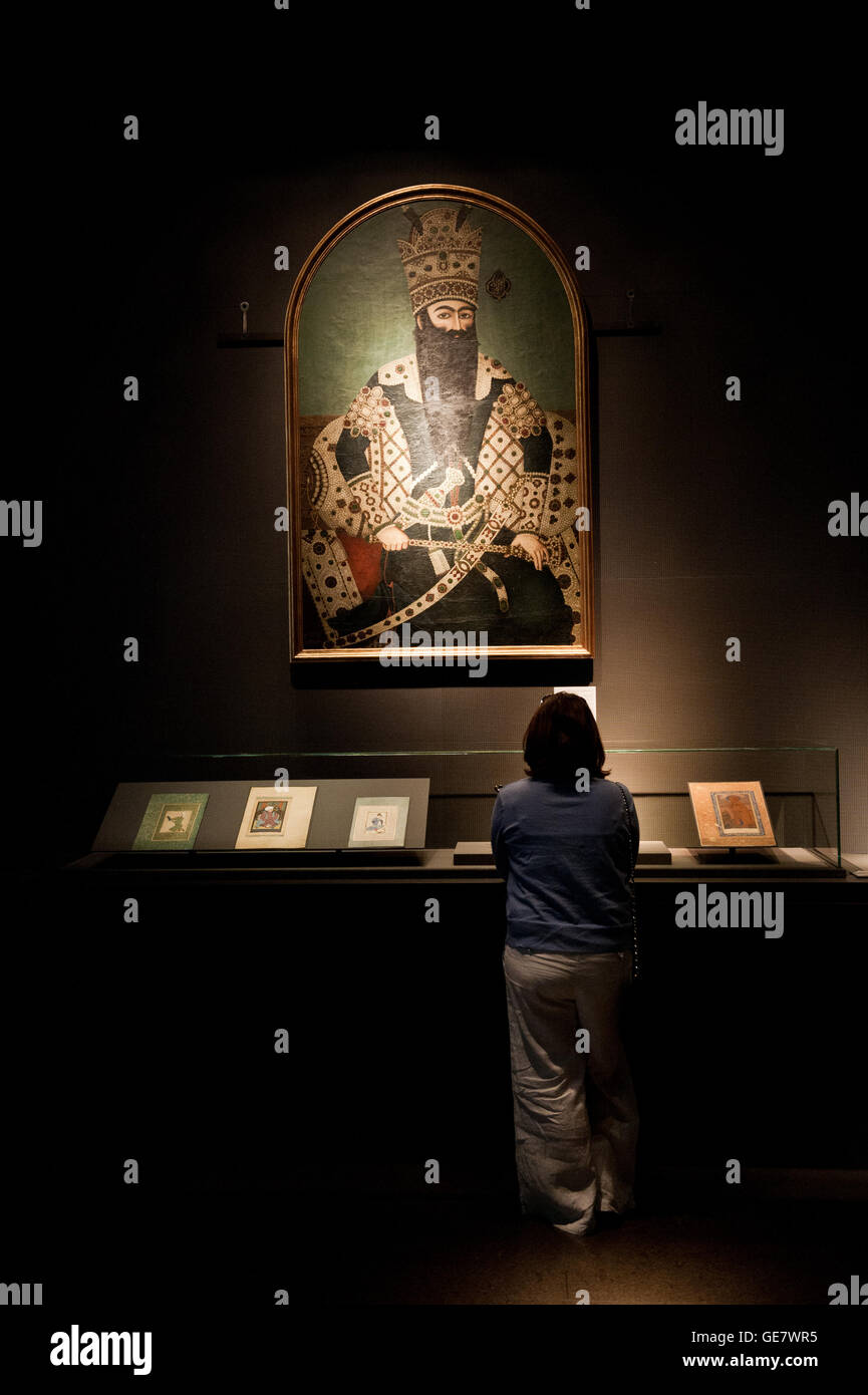 A visitor looks at an artwork on display at the Museum of Islamic Art ...
