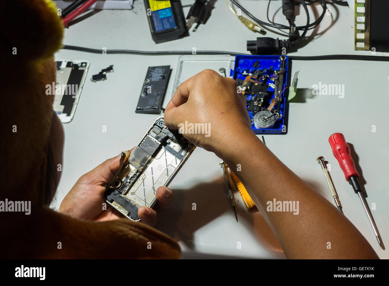 Engineers hands fixing smartphone Stock Photo - Alamy