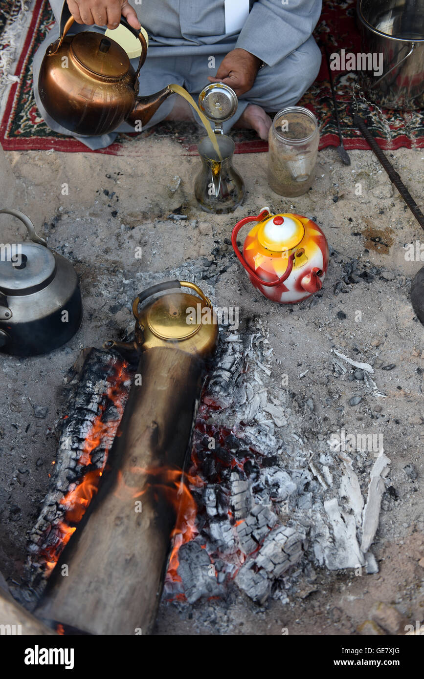 Preparation of the tea on fire in the traditional way Stock Photo - Alamy