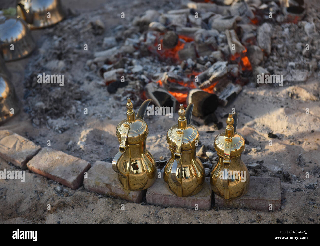Arabic coffee pots on the fire Stock Photo - Alamy