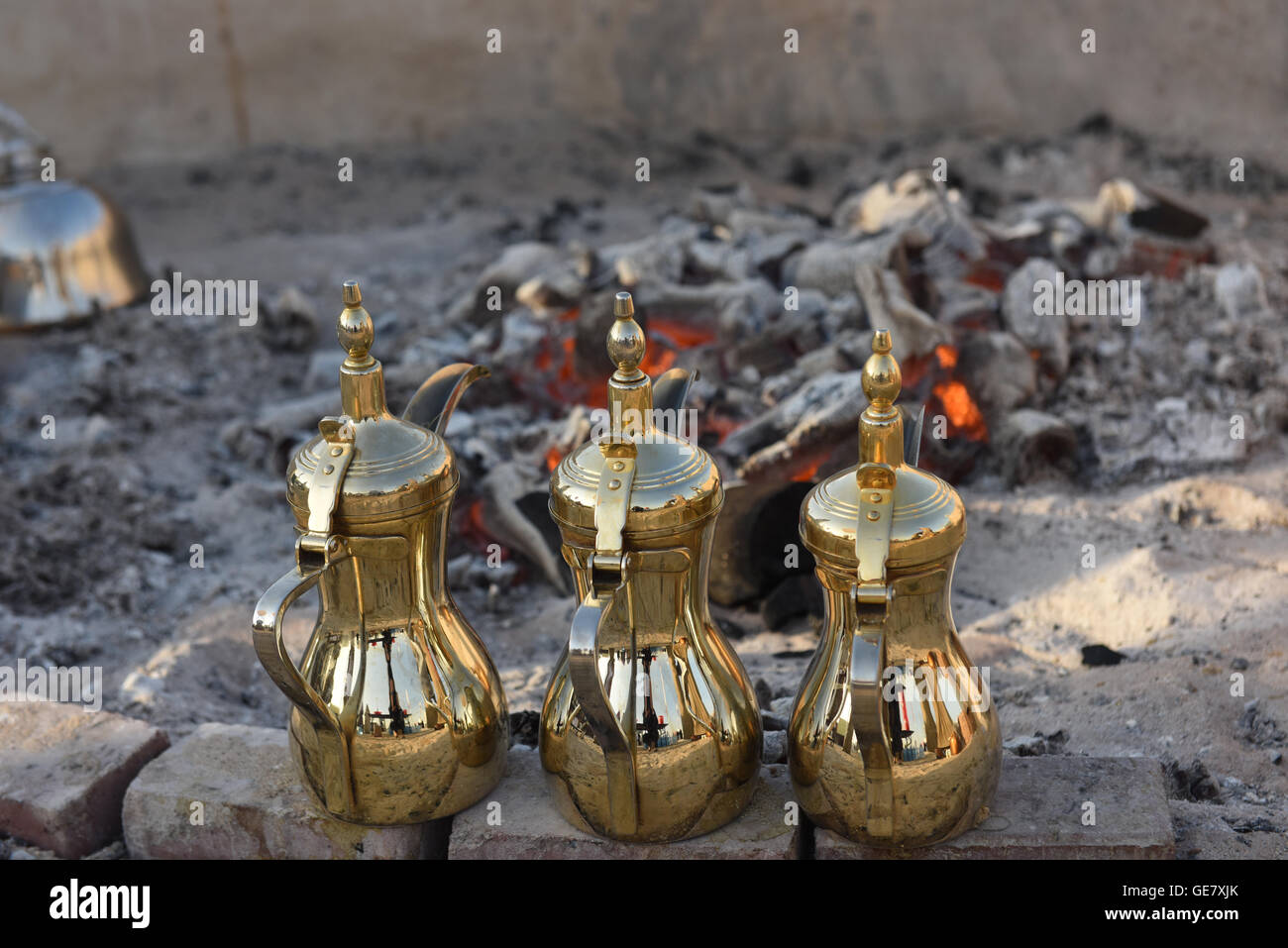 Arabic coffee pots on the fire Stock Photo - Alamy